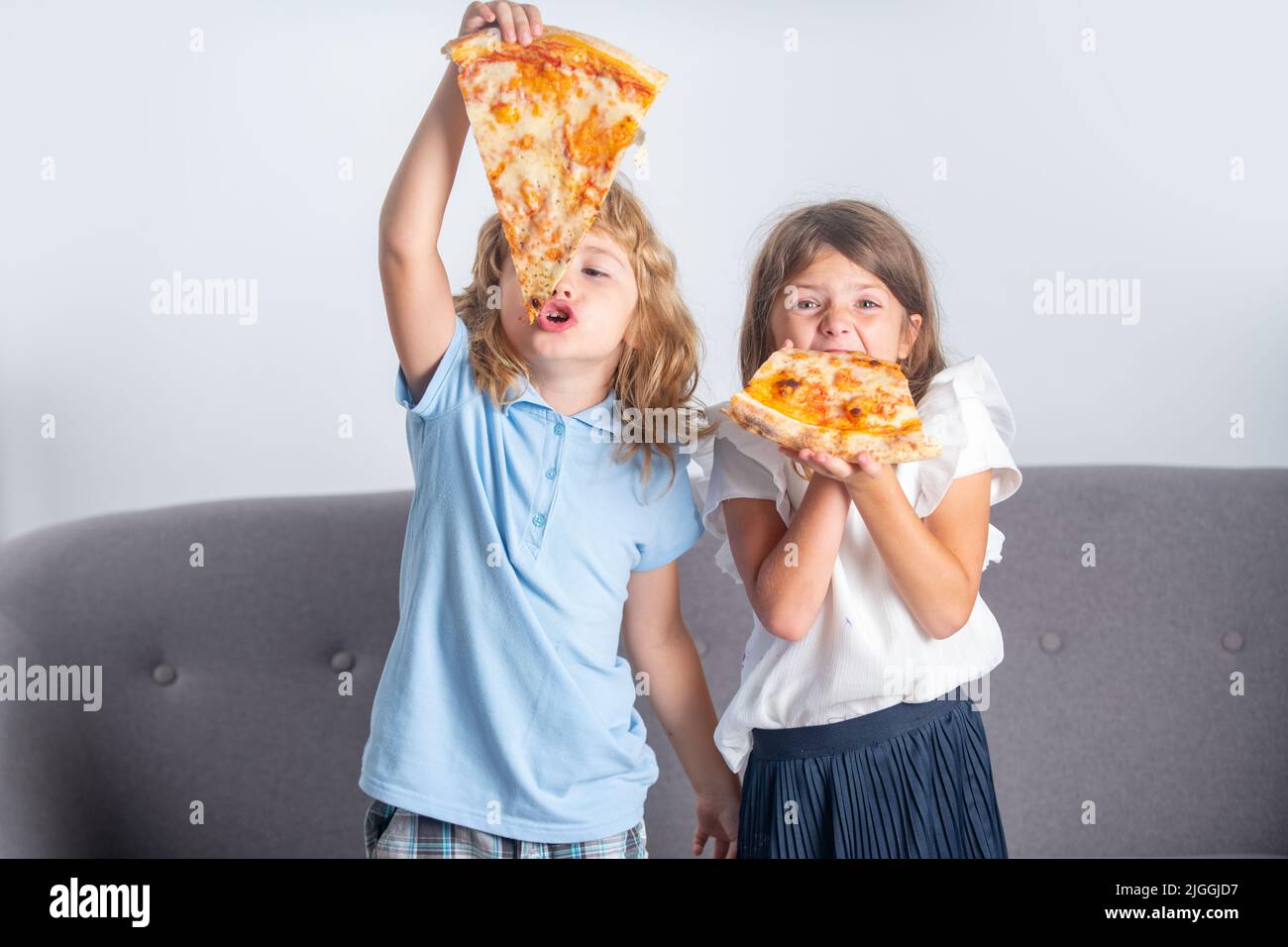 Pizza and kids, slices pizza in kids hand. Children eating tasty fast ...