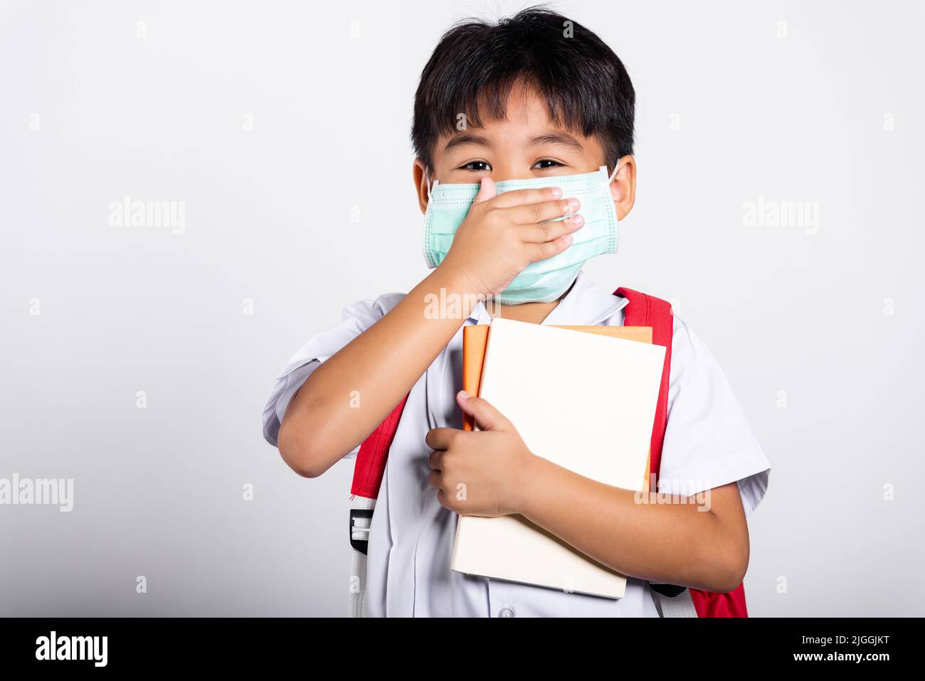 Asian student kid boy wearing student thai uniform and medical protect ...