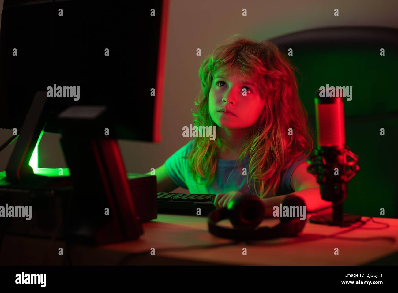 Child with pc computer at night. Overuse and addiction kids from ...