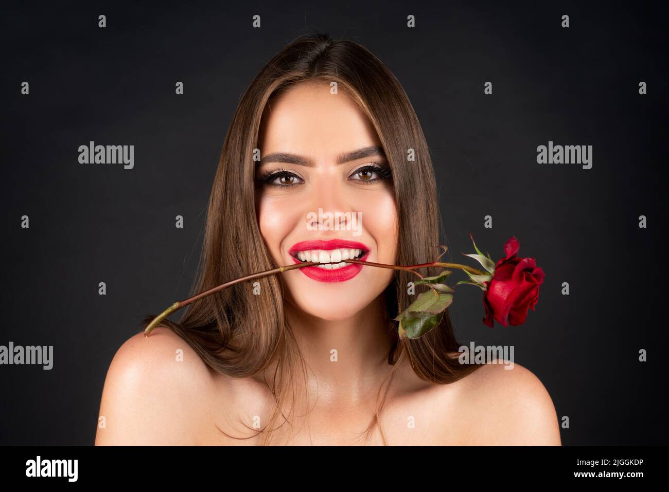Rose flowers in a mouth. Beauty romantic woman with rose flowers ...