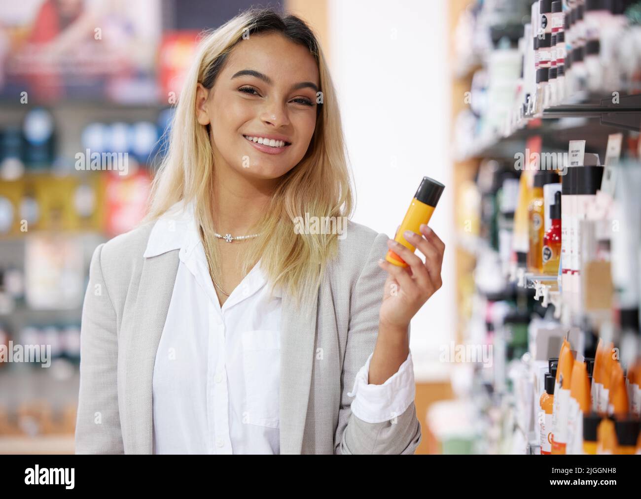 Its my favourite product. Cropped portrait of an attractive young woman ...