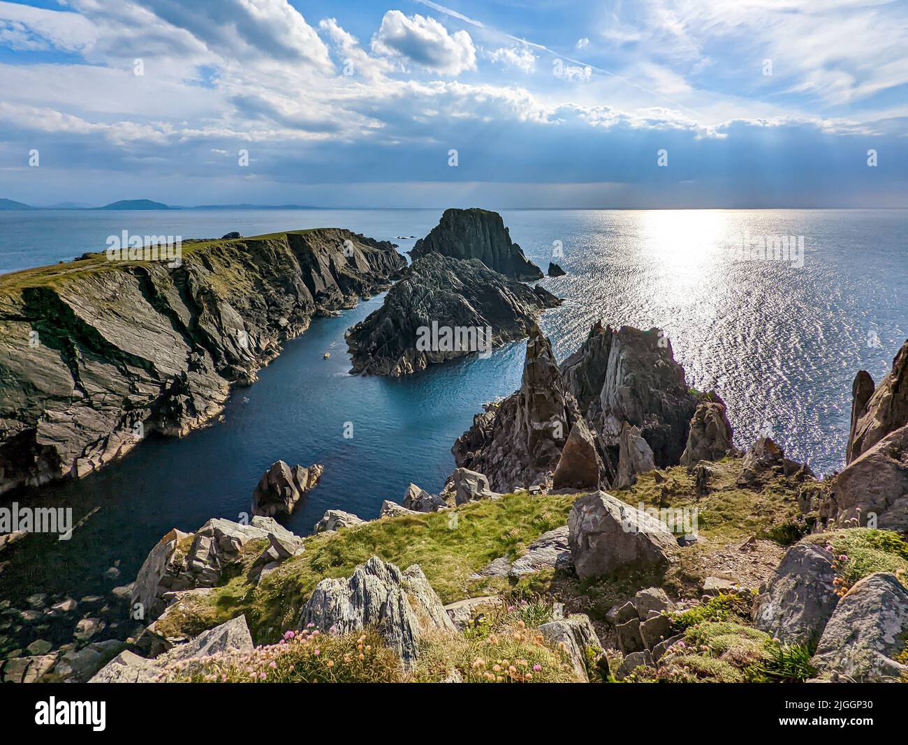 Irish landscape scene with sunlight shining through the clouds above ...