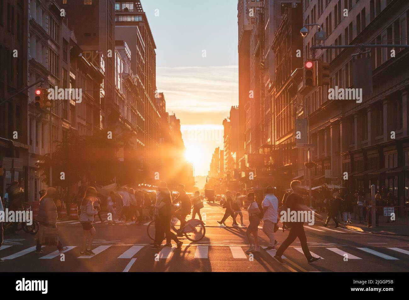 Busy intersection with crowds of people walking across the intersection ...