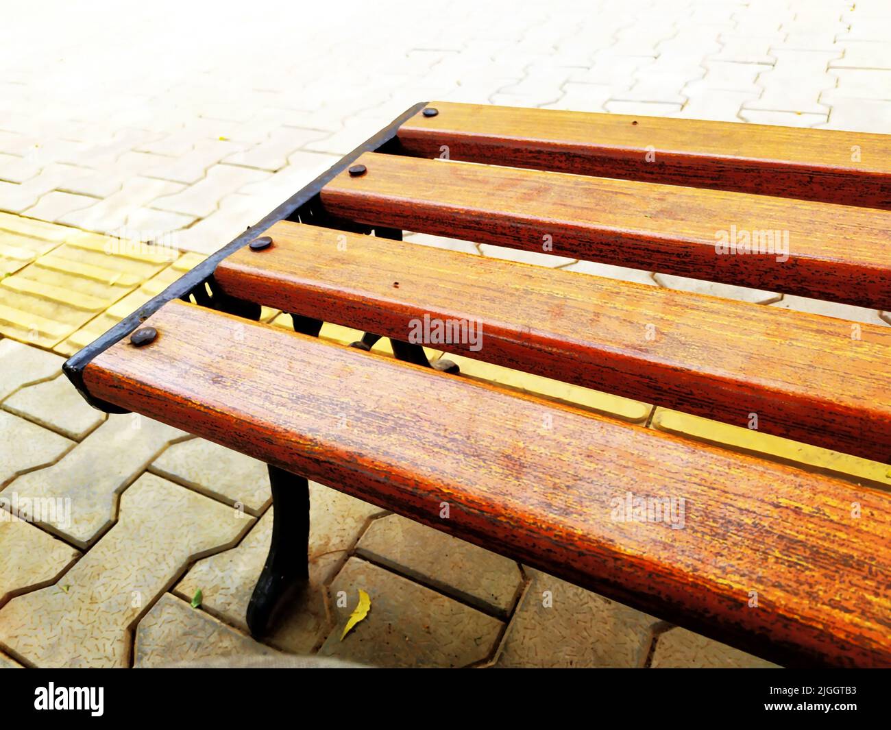 a sitting wooden brench in a garden Stock Photo - Alamy