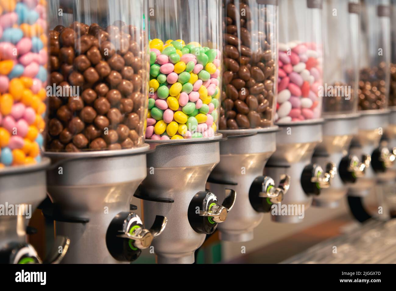 Bright candies in containers by weight in a candy store Stock Photo - Alamy