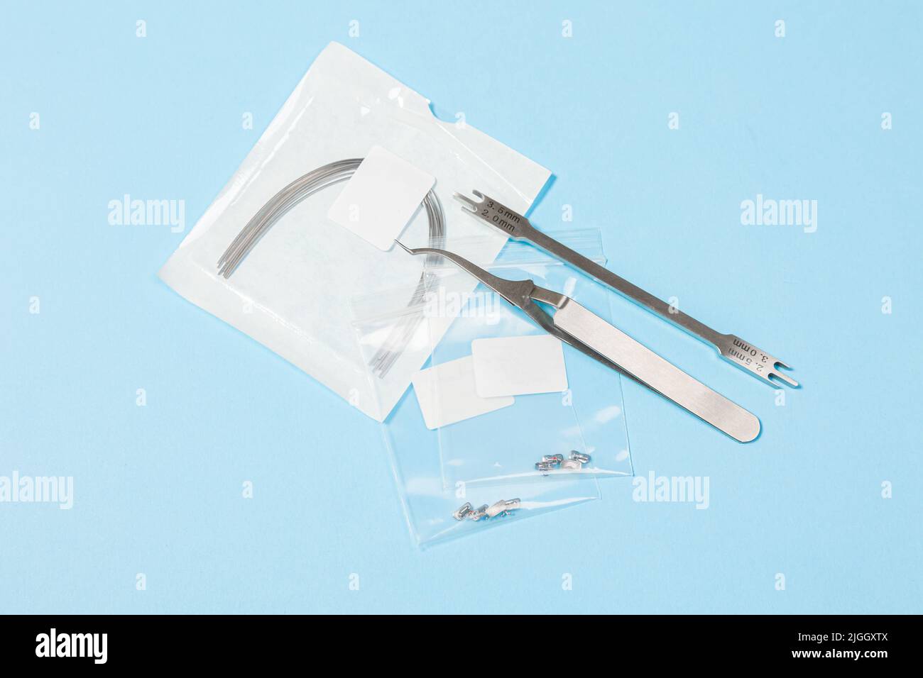 a set of special tools for an orthodontist to install braces for a ...