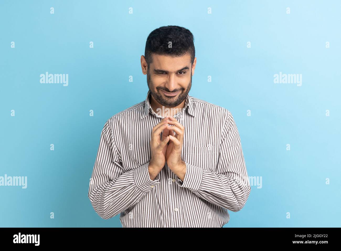 Portrait of funny tricky handsome businessman thinking devious plan ...