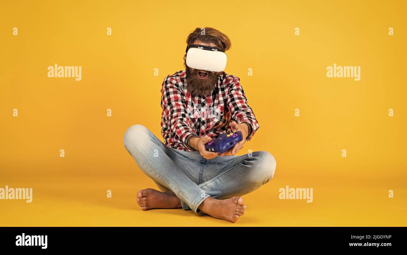 Testing new technologies. brutal man wearing virtual reality goggles ...