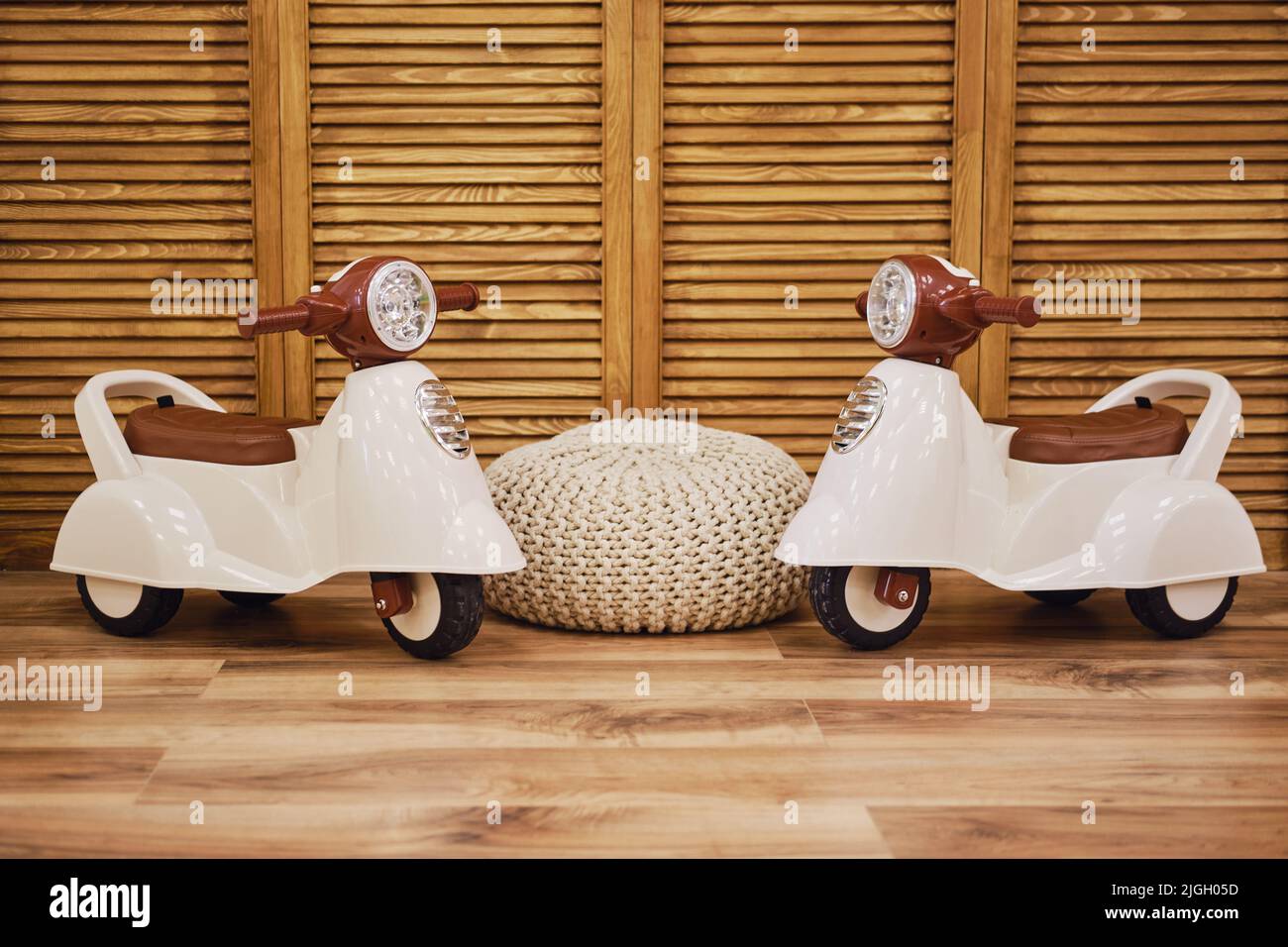 Plastic children motorcycle riding in the playroom, toy brown moped for ...