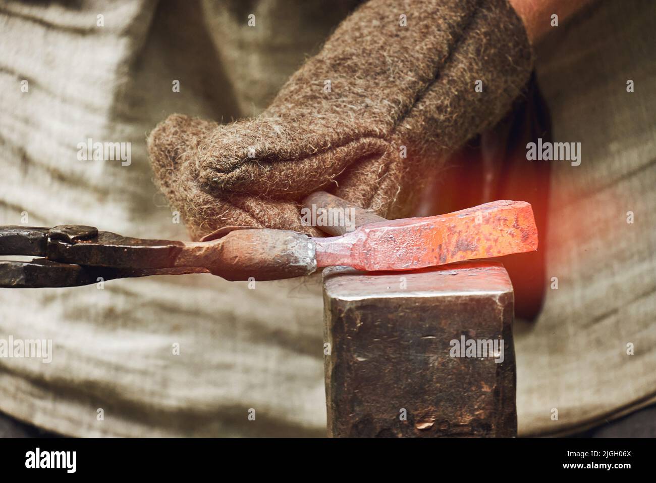Work of a medieval blacksmith for the manufacture of metal products ...