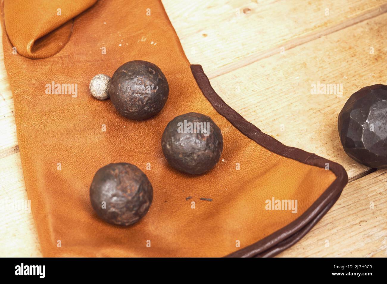 Vintage swedish cannons and metal cannonballs. Ancient military arsenal ...