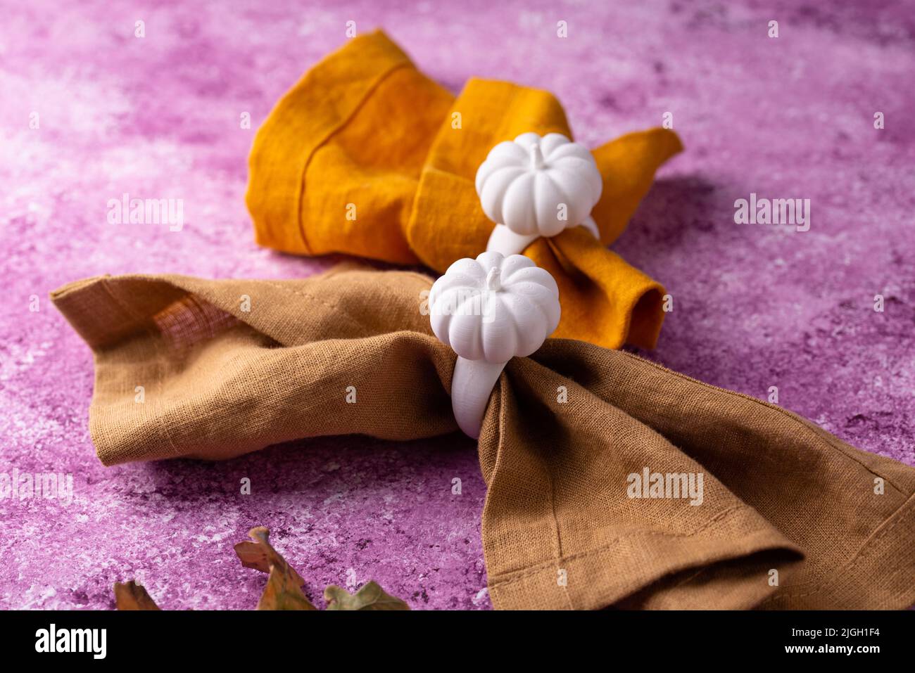 Linen napkin on lilac concrete background Stock Photo - Alamy