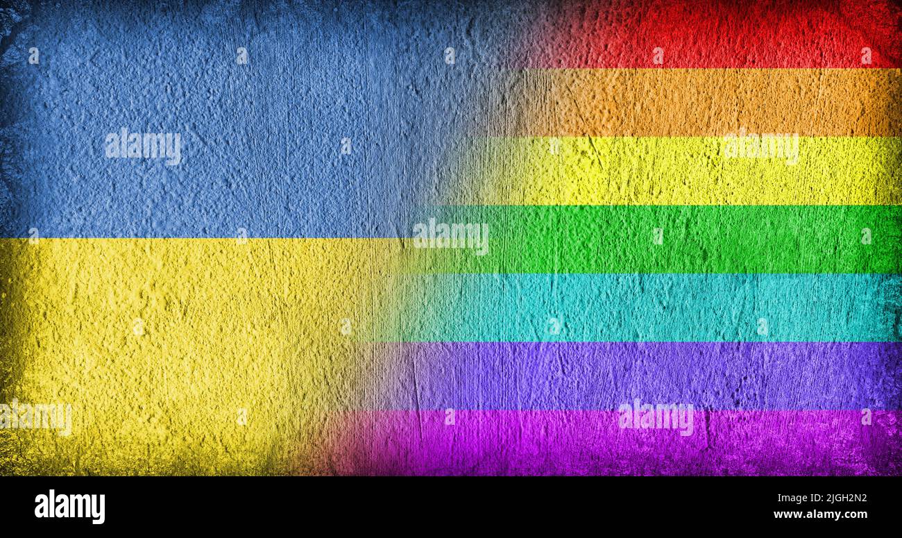 Ukrainian and Rainbow flag on concrete, divided in the middle Stock ...