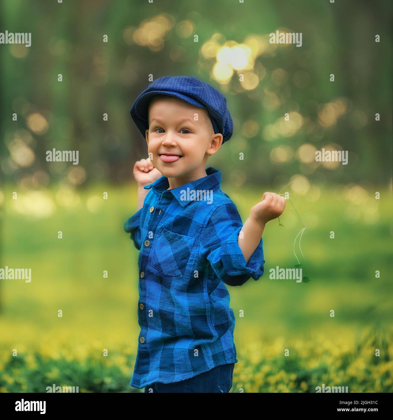 Happy little happy child boy, exploring nature with magnifying glass ...