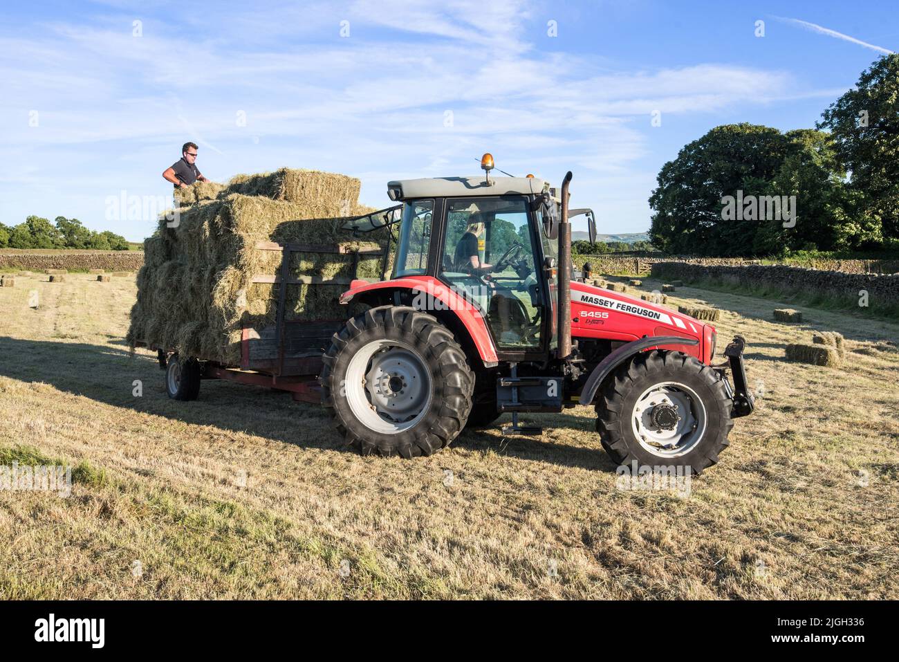 Collecting up traditional, small hay bales at Long Preston, North ...