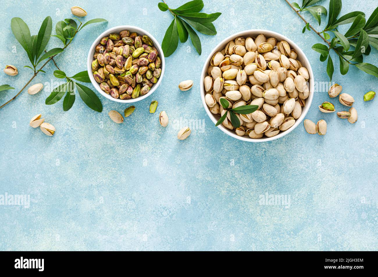 Pistachios. Whole pistachios with green leaves and pistachio nut ...