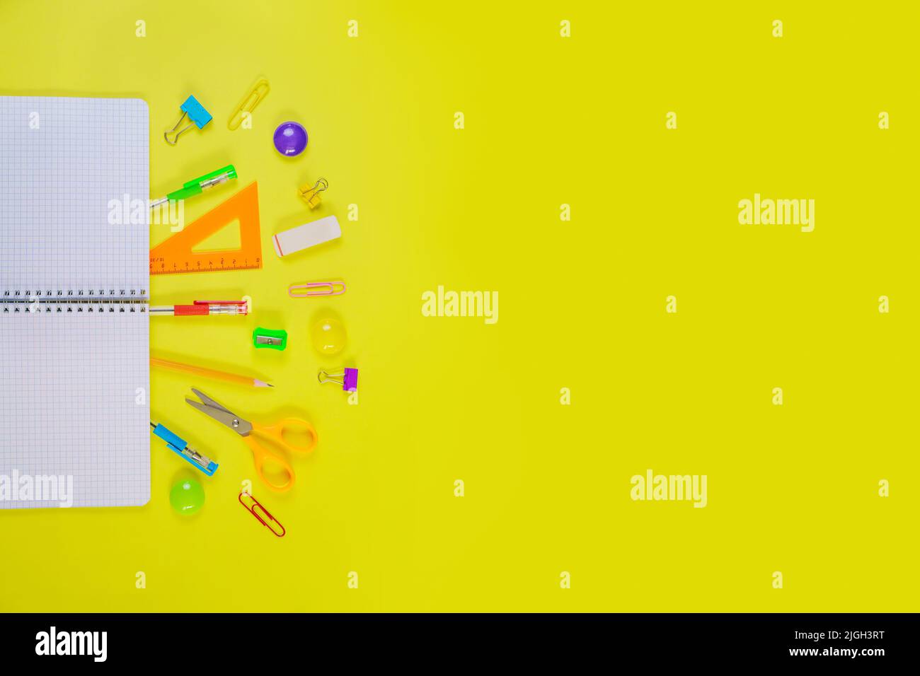 Notebook with a pen and colorful notes on a blue and orange background ...