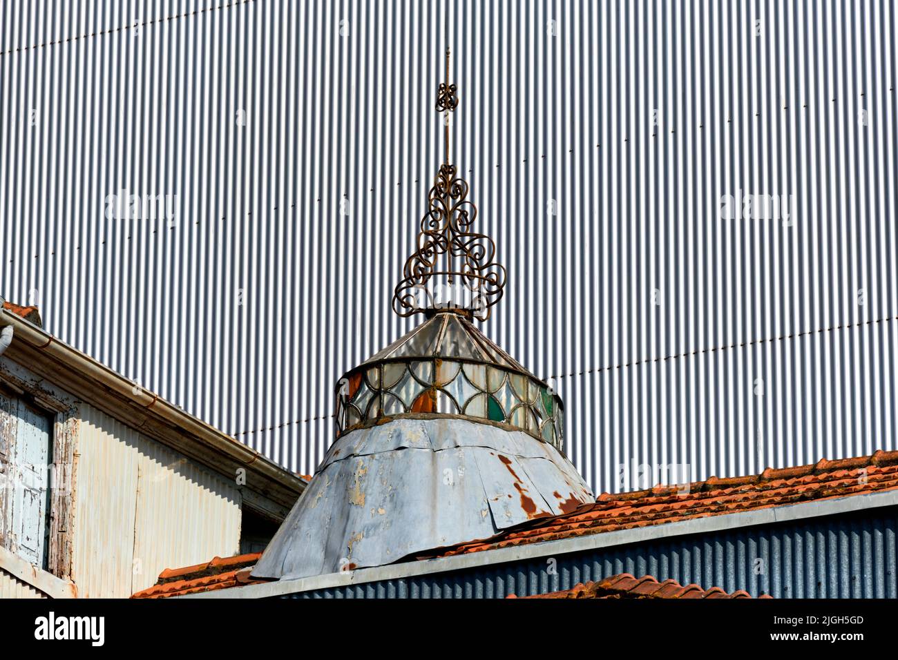traditional colored glass skylights topped with a wrought iron spire on ...