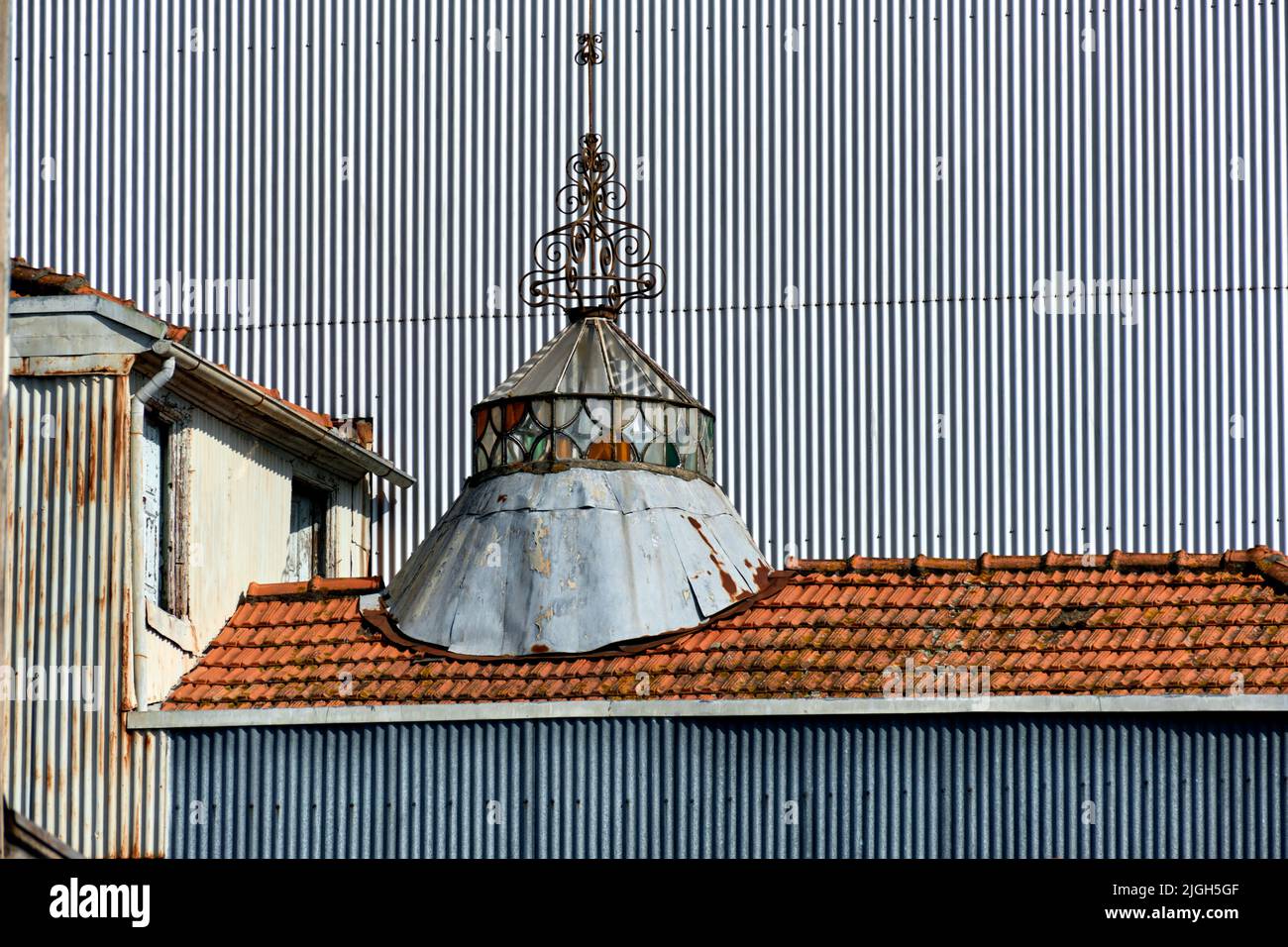 traditional colored glass skylights topped with a wrought iron spire on ...