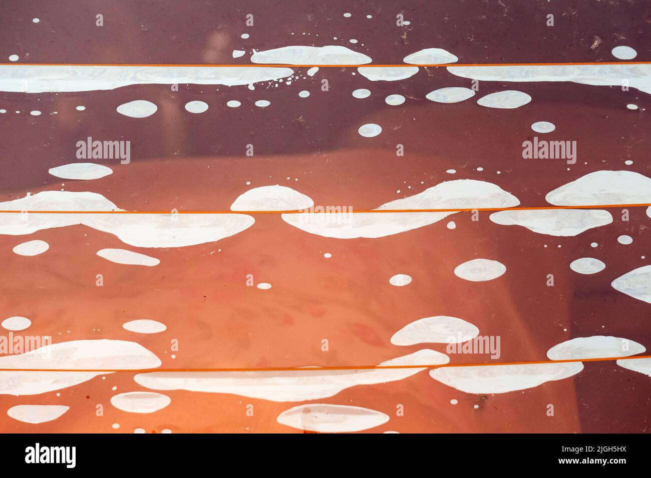 Close up to rear window of car with bubbles on glass very poor ...