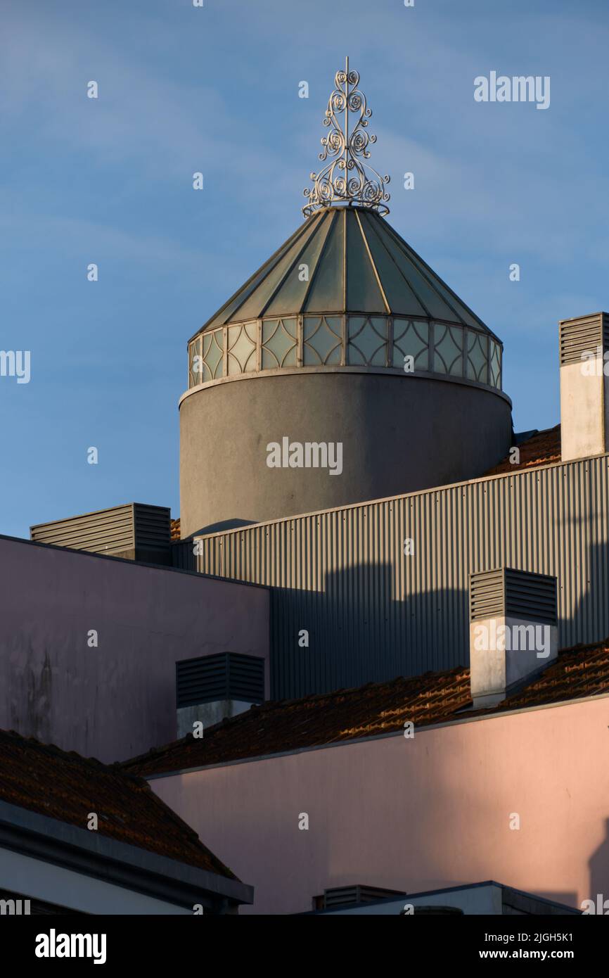 traditional glass skylights topped with a wrought iron spire on a roof ...