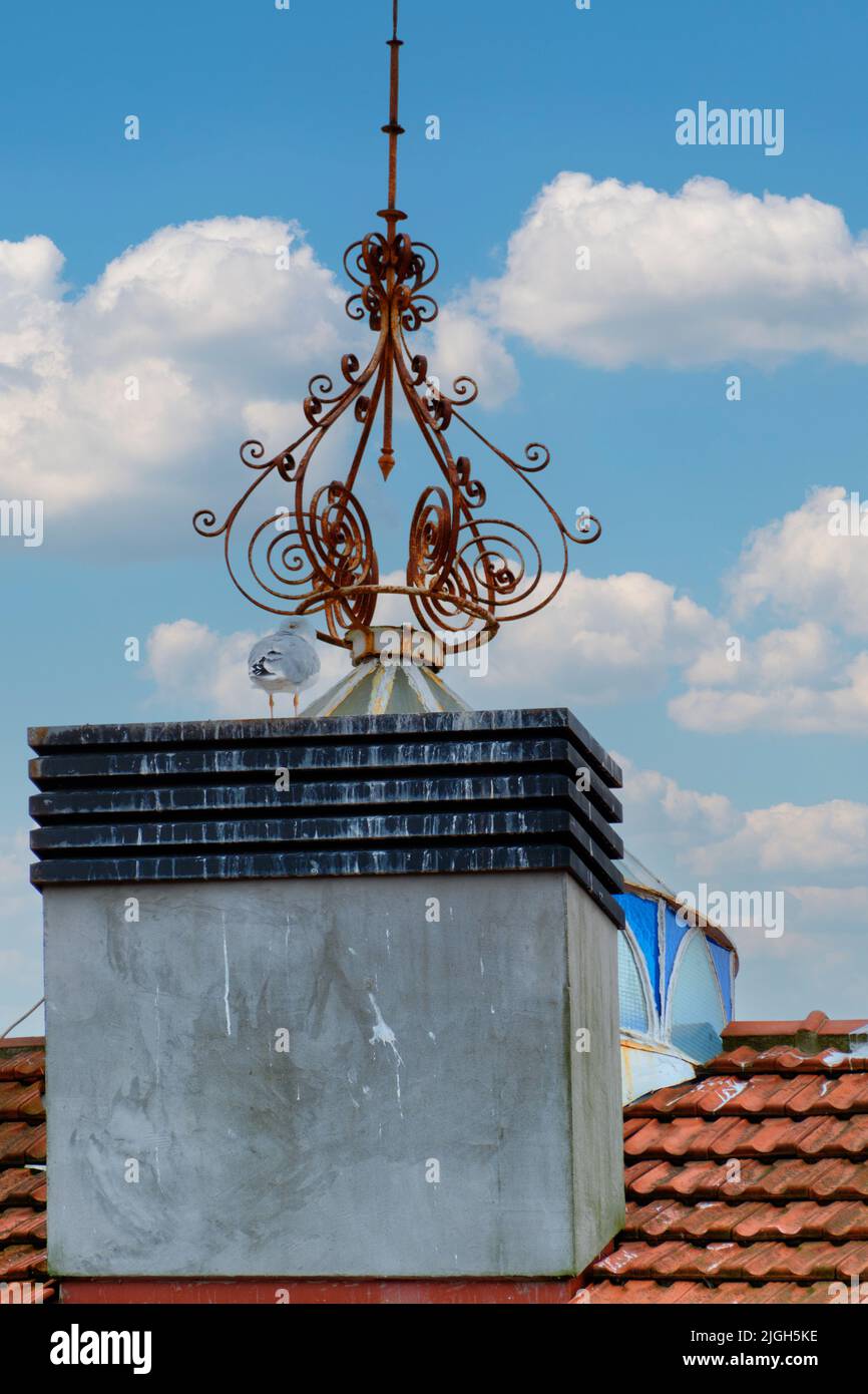 traditional colored glass skylights topped with a wrought iron spire on ...