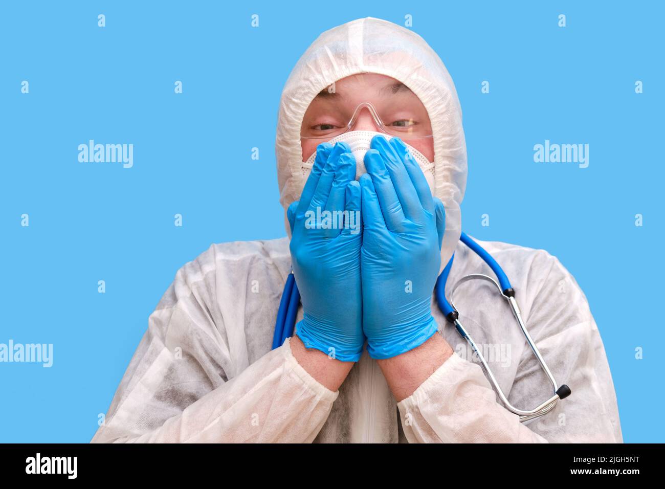 Man doctor medic in a protective suit uniform with goggles and face ...