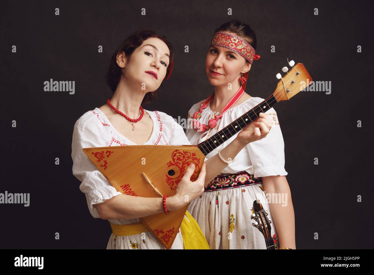 Women musicians in Russian folk dresses with musical instruments on a ...
