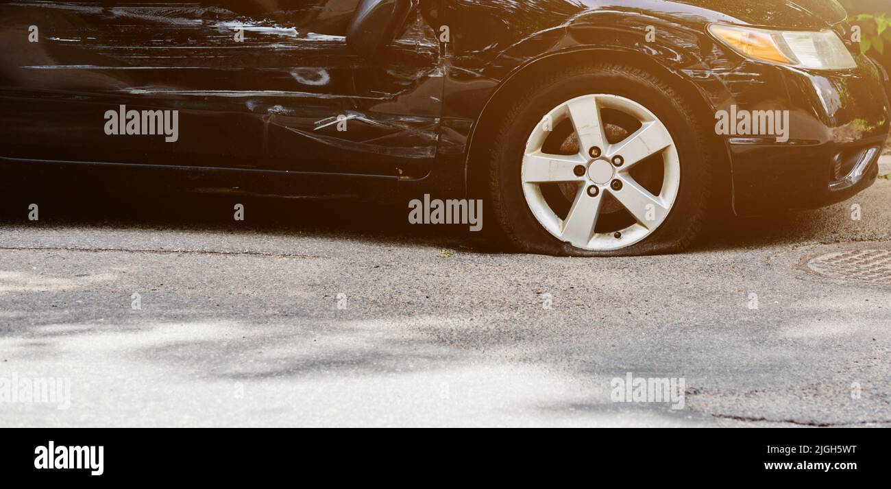 punctured wheel. Damaged flat tire of old car Stock Photo - Alamy