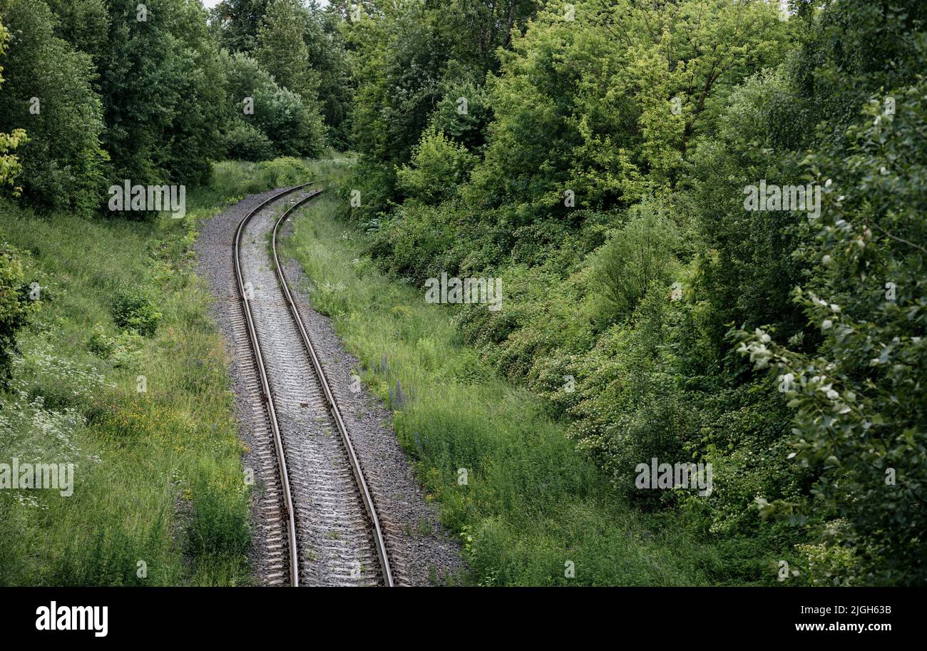 Railway infrastructure. Rail tracks in the green field. cargo delivery ...