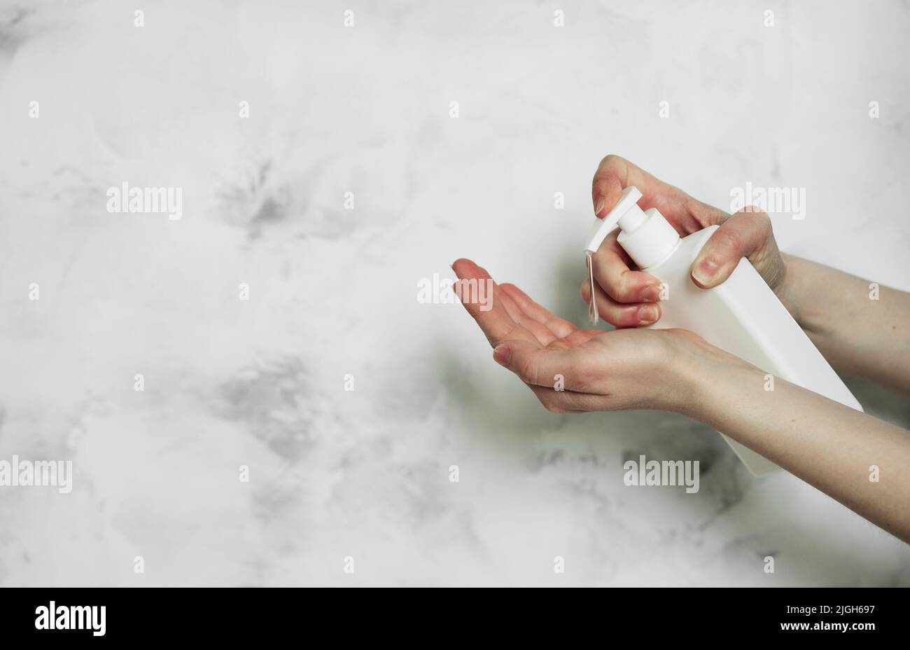 hand soap with pumping lotion from bottle. hand hygiene and skin care ...