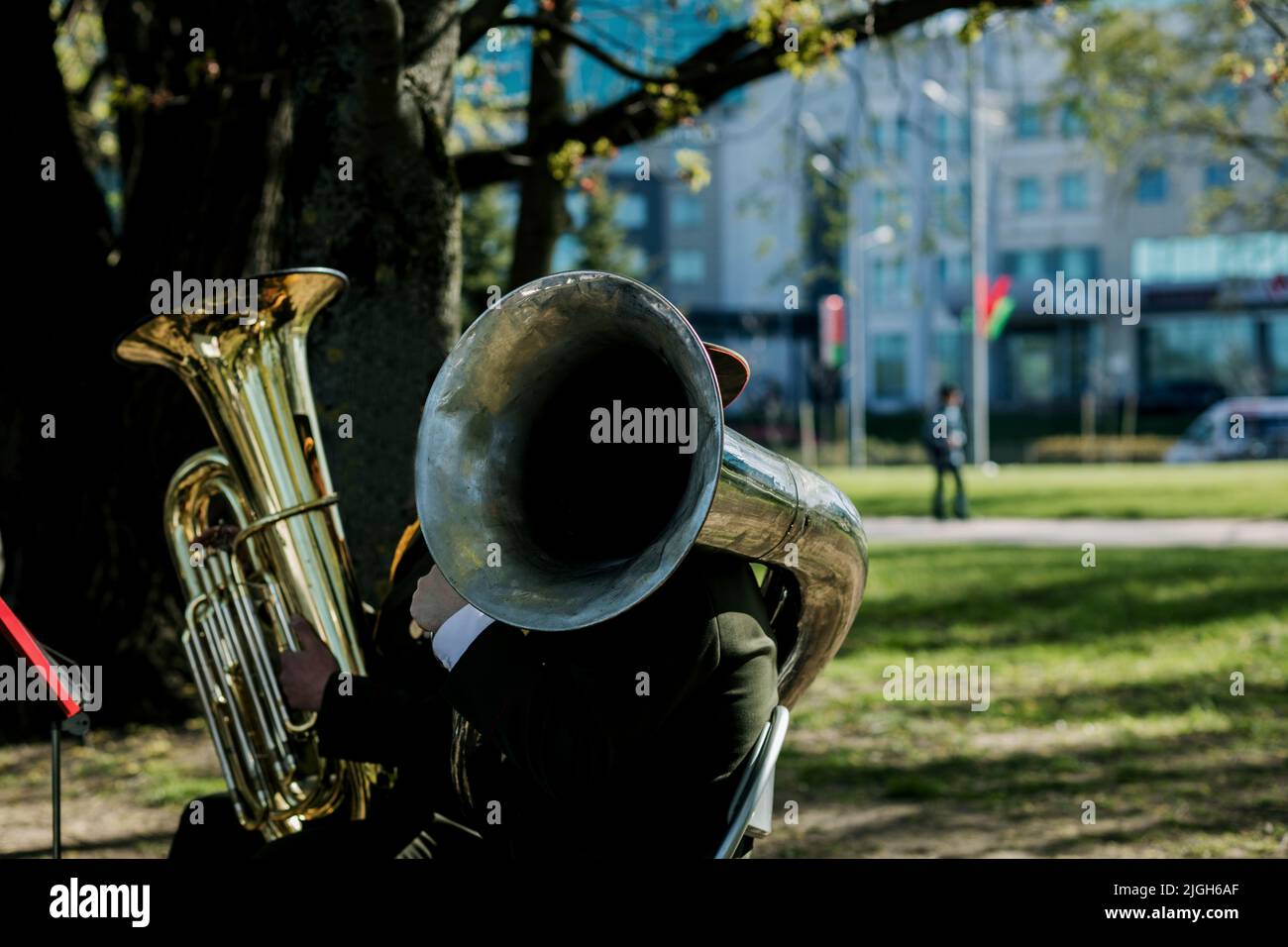 musician playing tuba outdoors. big brass tuba Stock Photo - Alamy