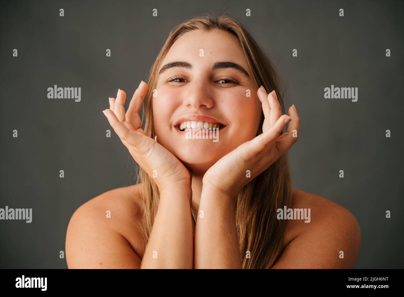 Framing her face with her hands hi-res stock photography and images - Alamy
