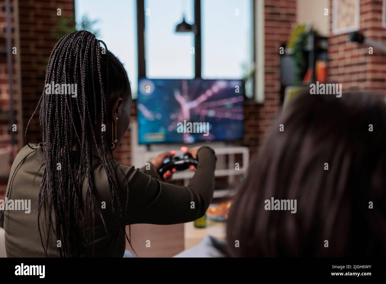 Modern person having fun with shooting video games on console, playing ...