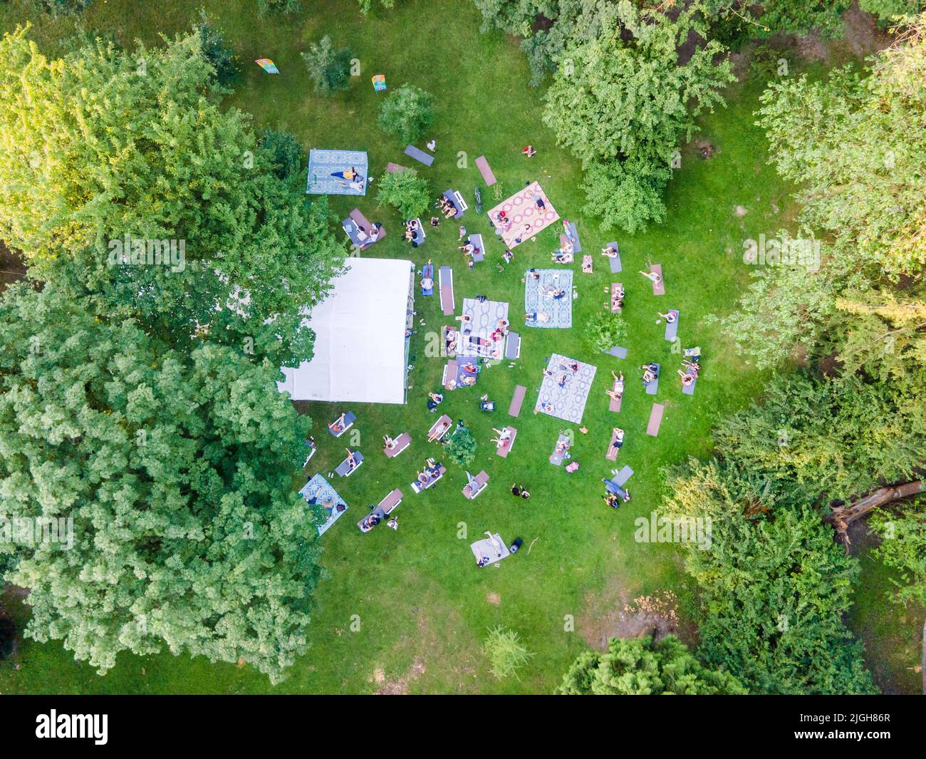 people laying down at city public park overhead top view outside ...
