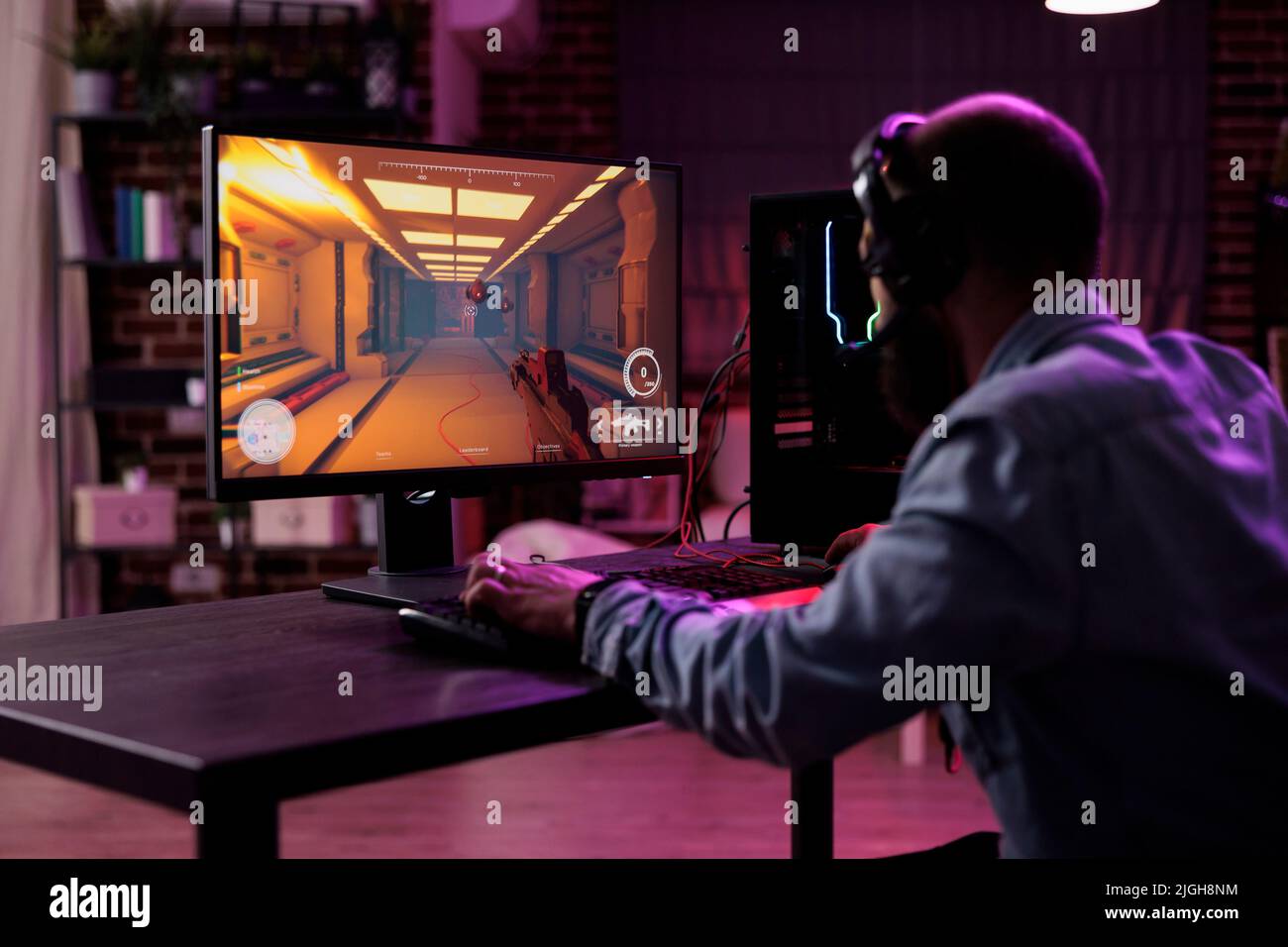 Content creator having fun with video games play competition, using ...