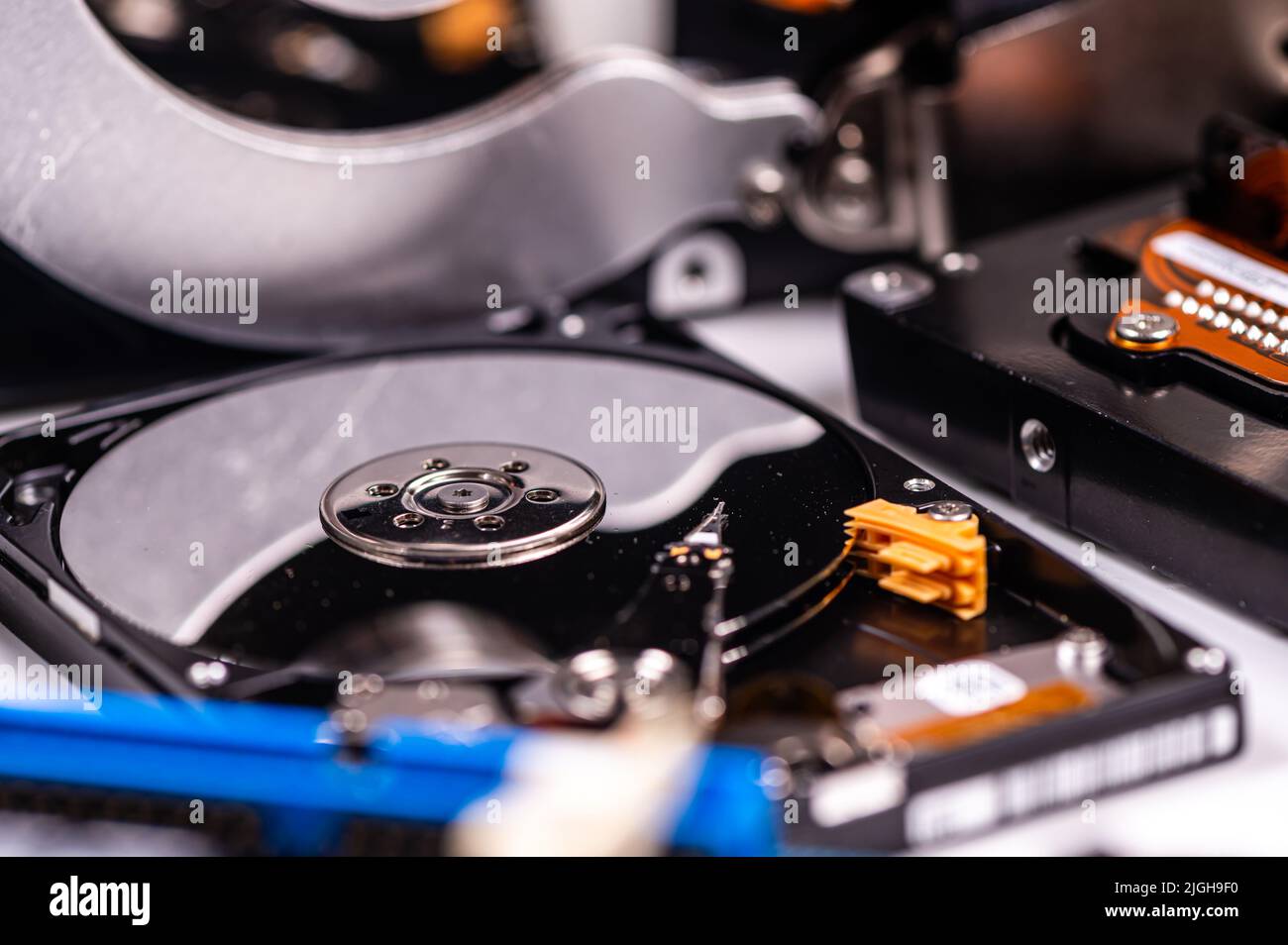 an open computer hard drive between other parts of the computer ...