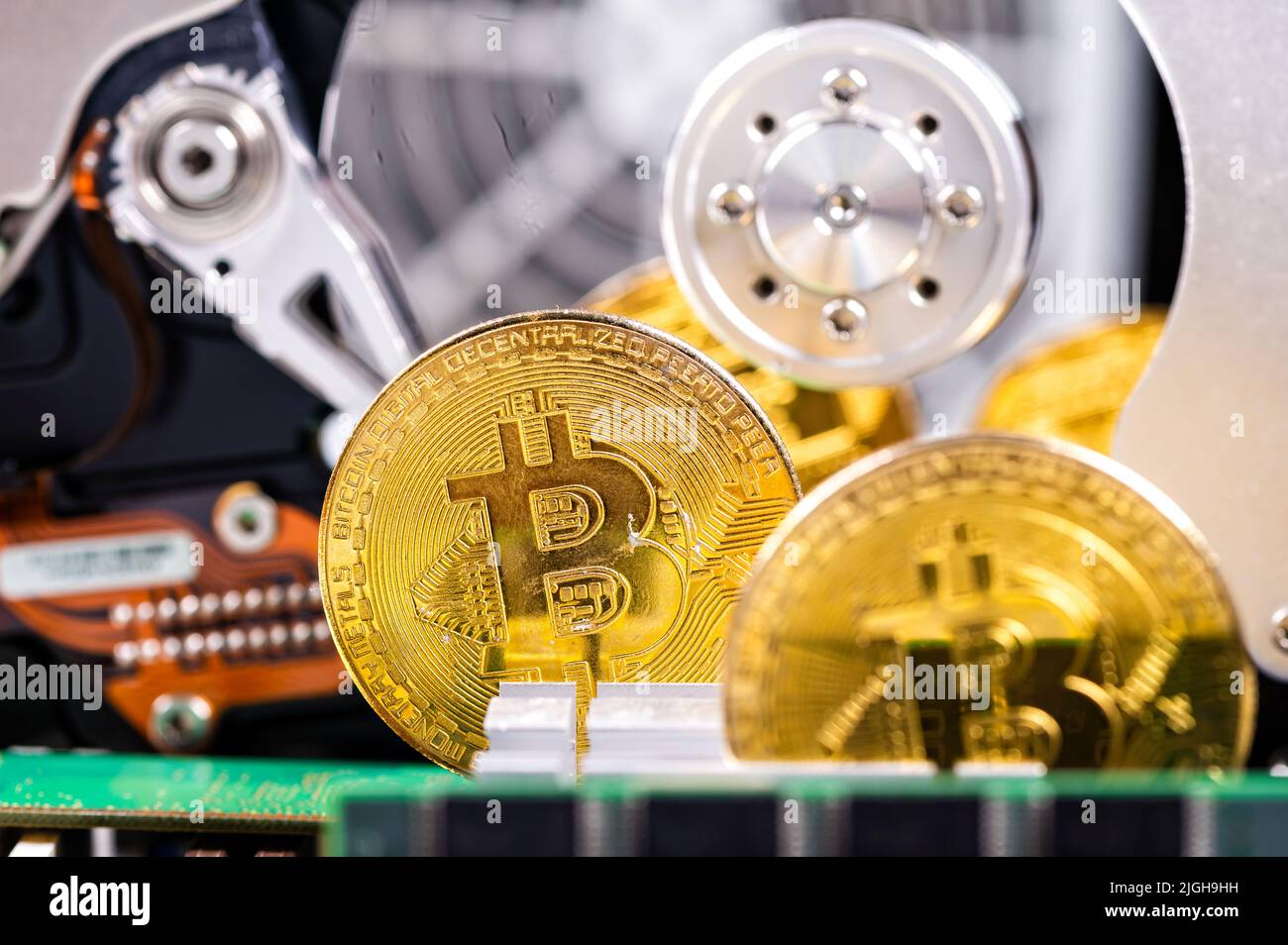 close-up of gold bitcoin on computer components background, technology ...
