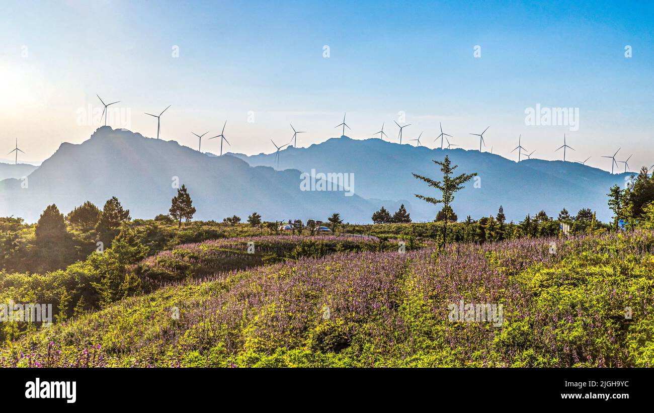 CHONGQING, CHINA - JULY 10, 2022 - Wind turbines stand on the ...