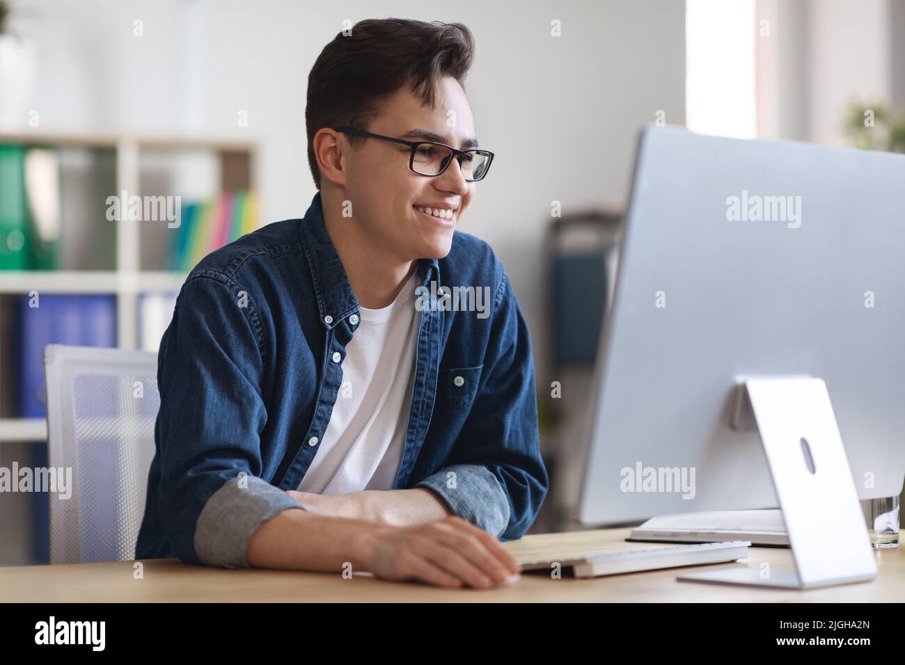 Portrait Of Smiling Millennial Businessman Working On Computer In ...