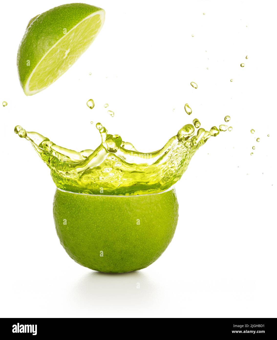 juice spraying out of a lime isolated on white Stock Photo - Alamy
