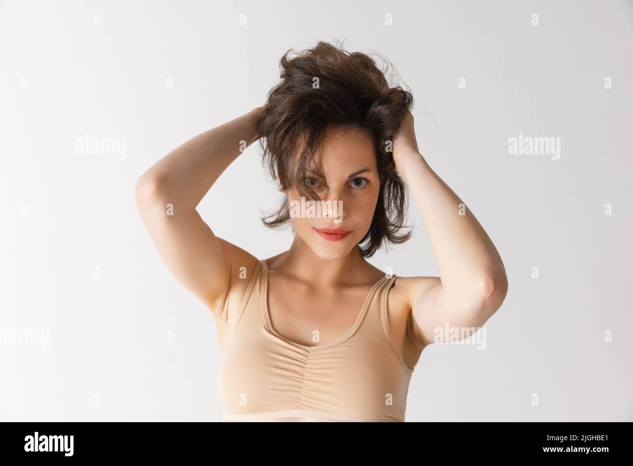 Young pretty woman with well-kept skin without makeup isolated on white ...