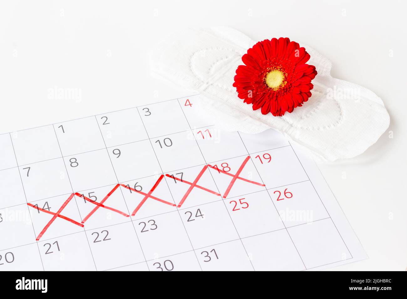 Calendar with red marks and white pad. Menstruation period concept ...
