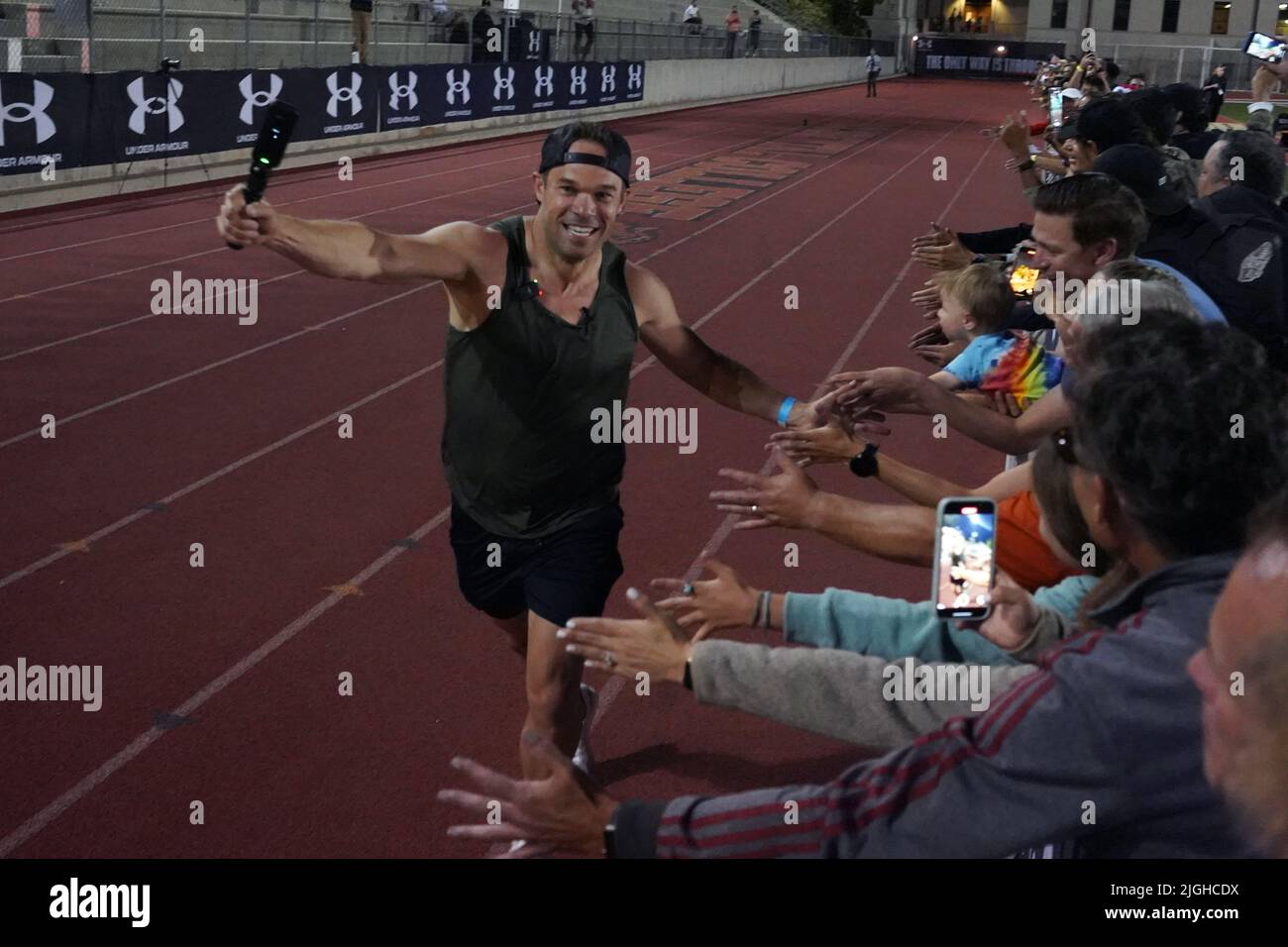 Nick Symmonds attempts a world record for most high fives in sixty ...