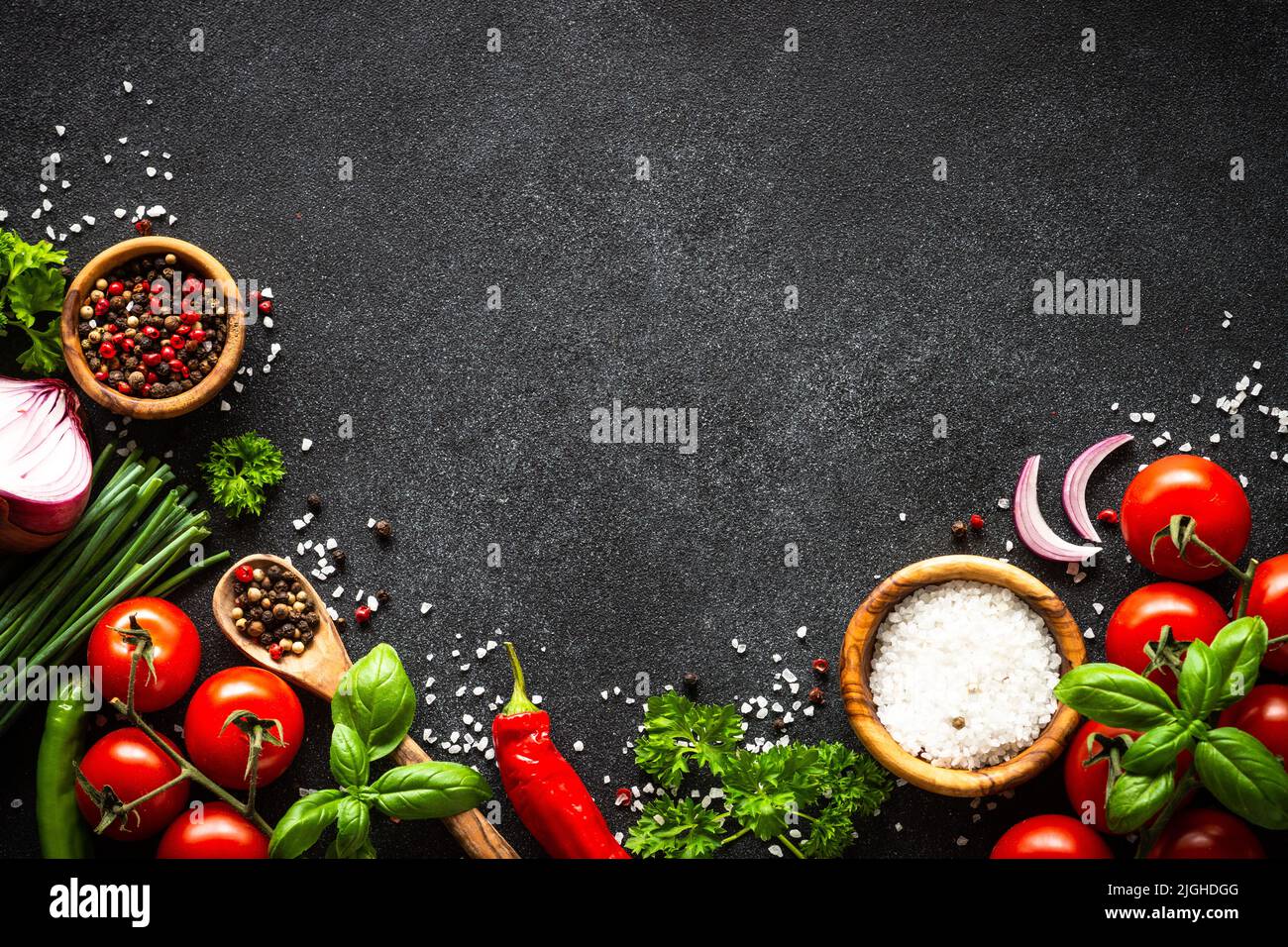 Food cooking background on black stone table Stock Photo - Alamy