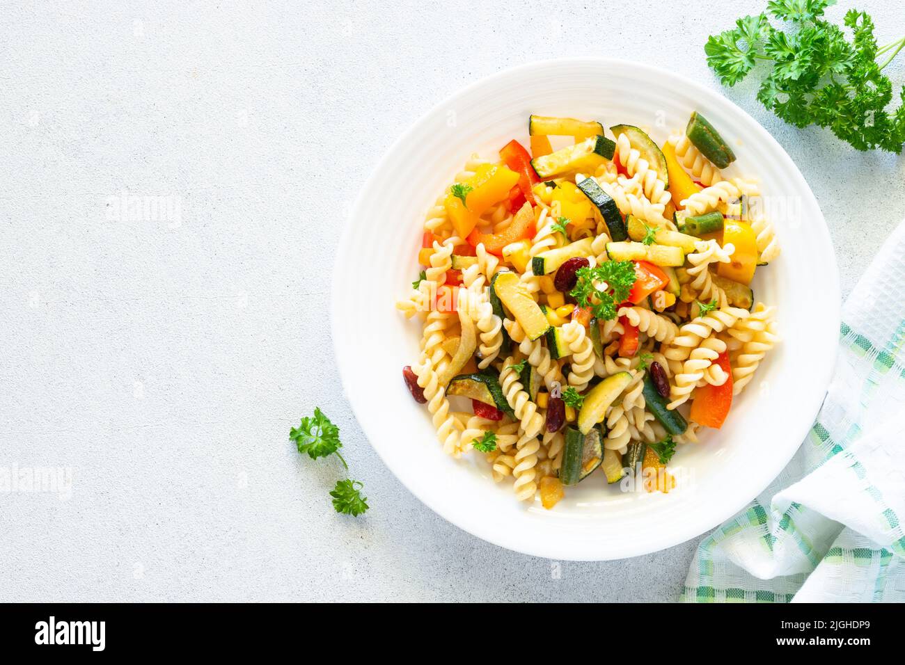 Vegan pasta fusilli with vegetables, zucchini, paprika and grean beans ...