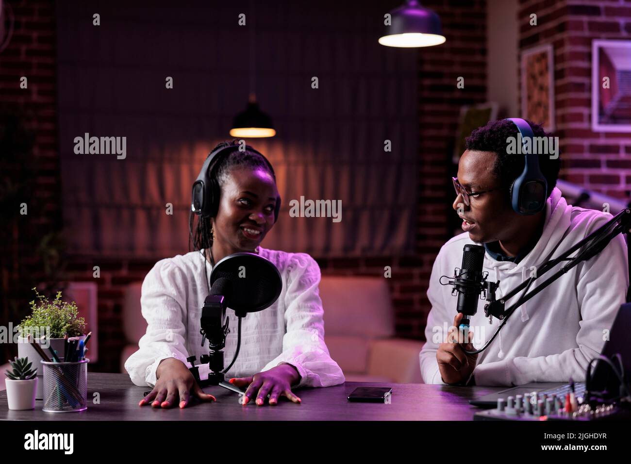 Happy content creators chatting on podcast talk show, recording live ...