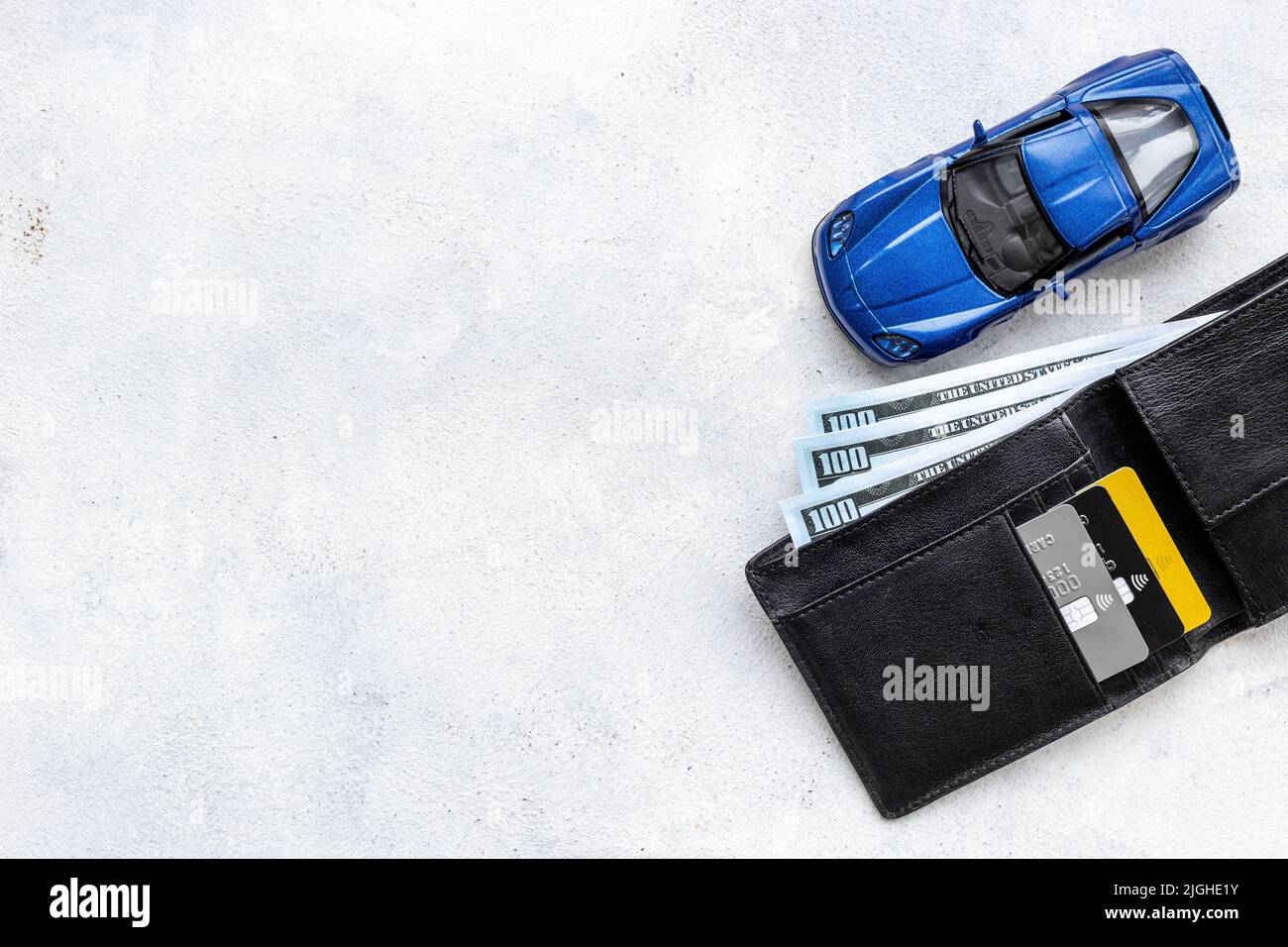 Purchase or rent a car concept. Toy car with wallet and money cash ...