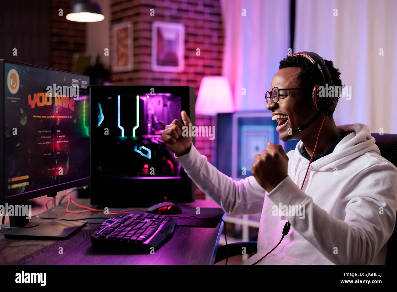 Young adult winning online video games tournament on pc, streaming ...