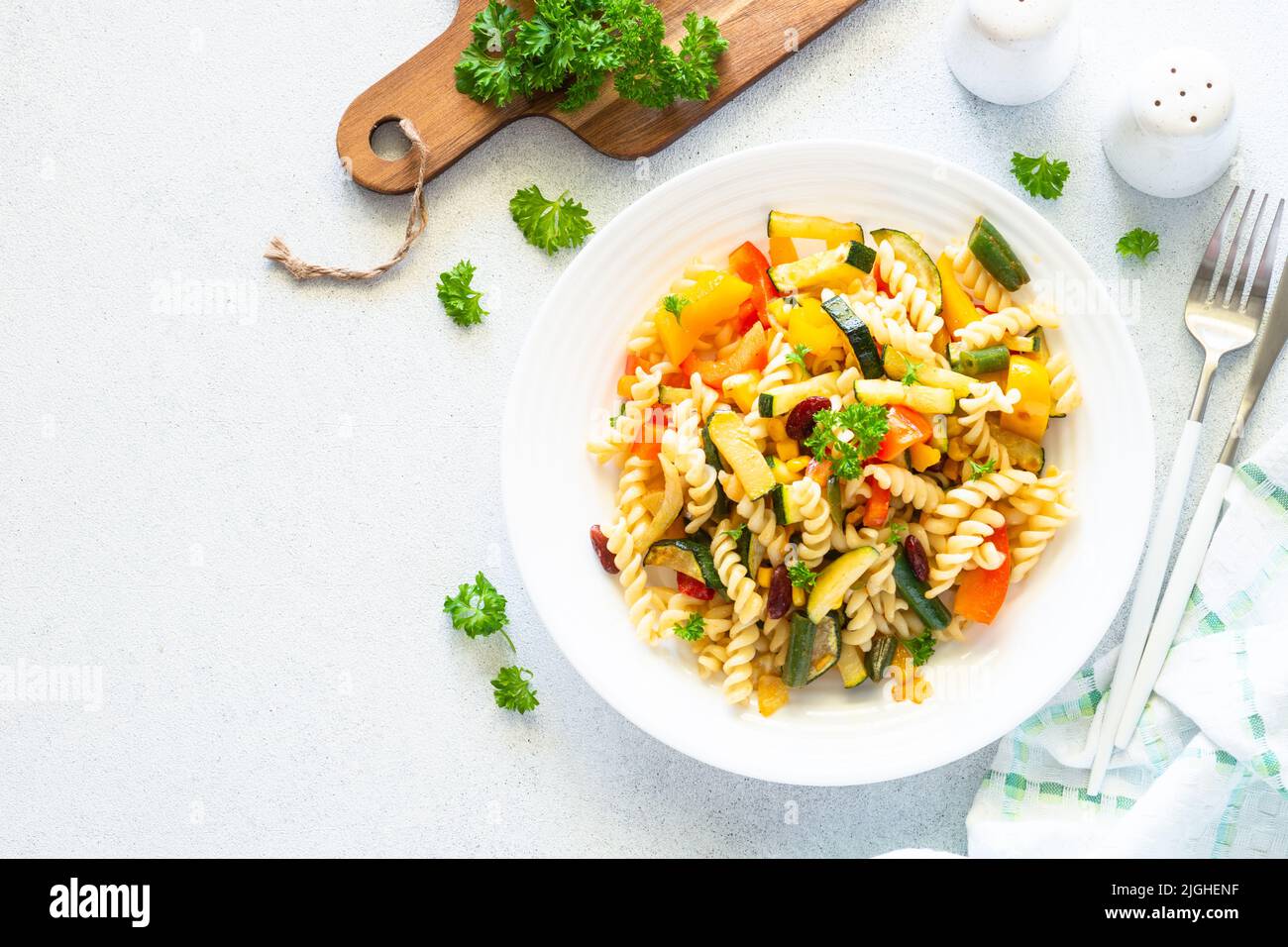 Vegan pasta fusilli with vegetables, zucchini, paprika and grean beans ...